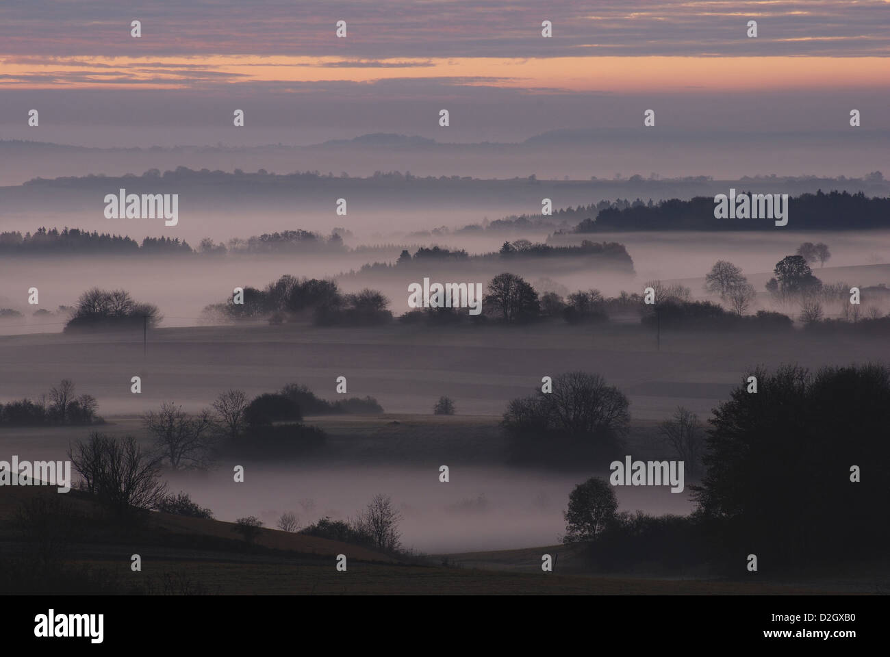 Early morning mist at Sonnenbühl in the Swabian Alb, sunrise facing ...