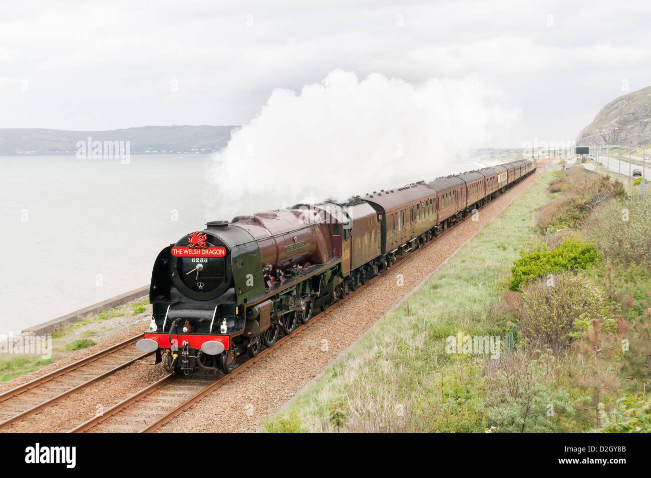 Steam locomotive pulling a passenger train on the Mainline in Wales ...