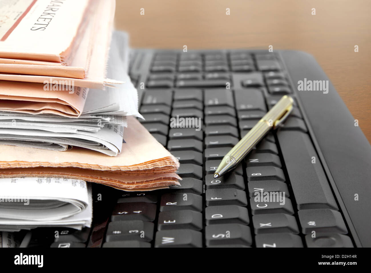 Newspapers on the Keyboard Stock Photo - Alamy