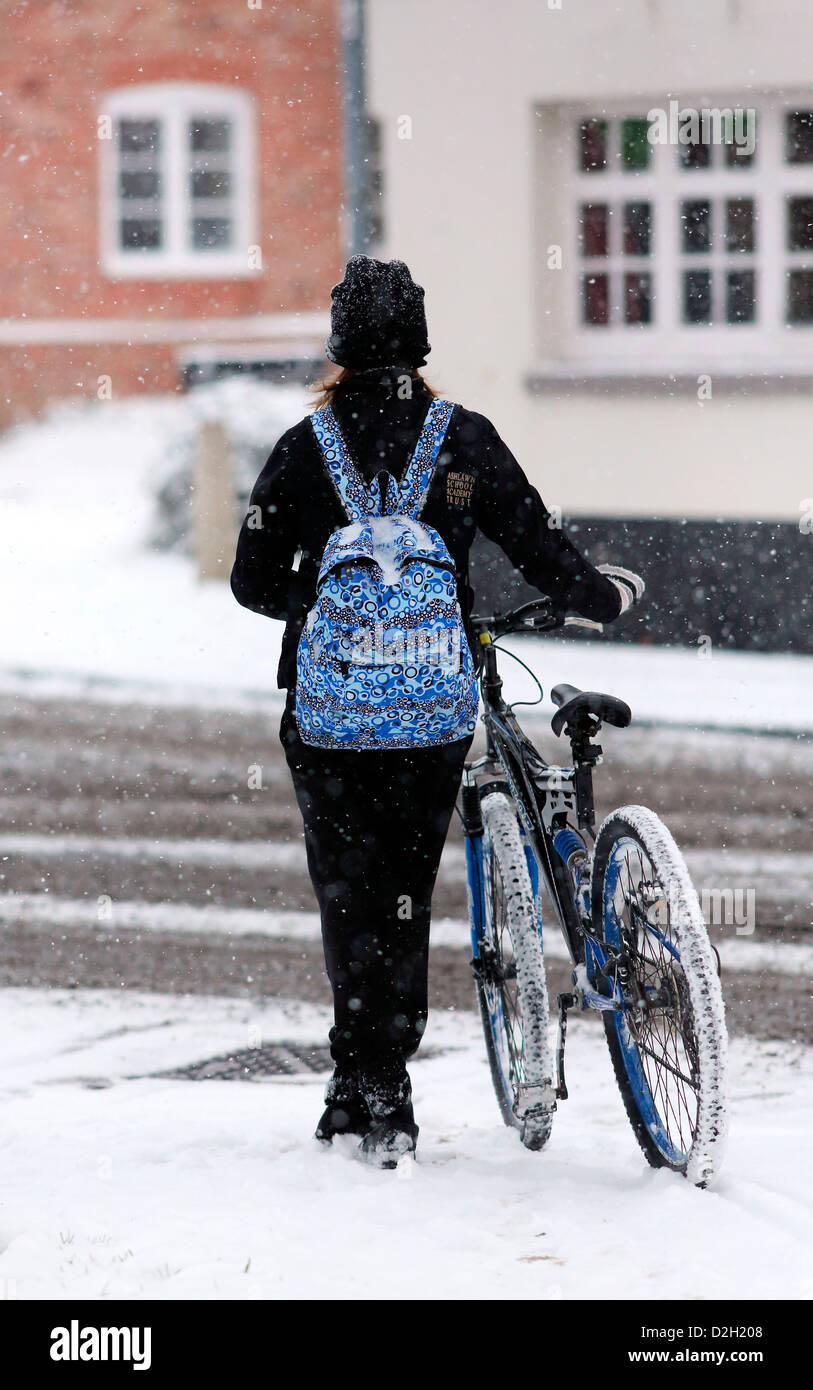 pupil with bike in snow Stock Photo - Alamy