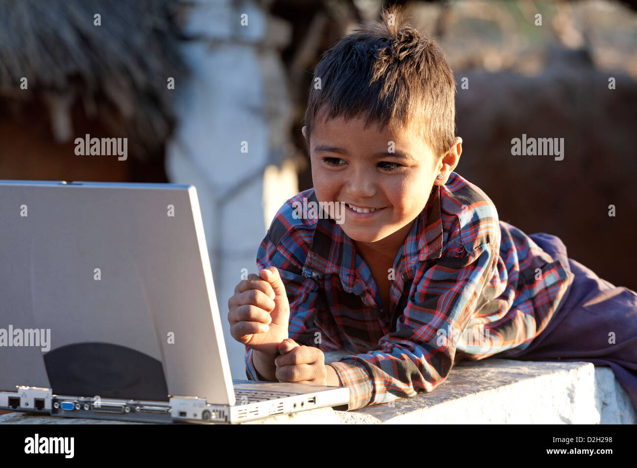 India, Rajasthan, Jodhpur, village boy using laptop Stock Photo - Alamy