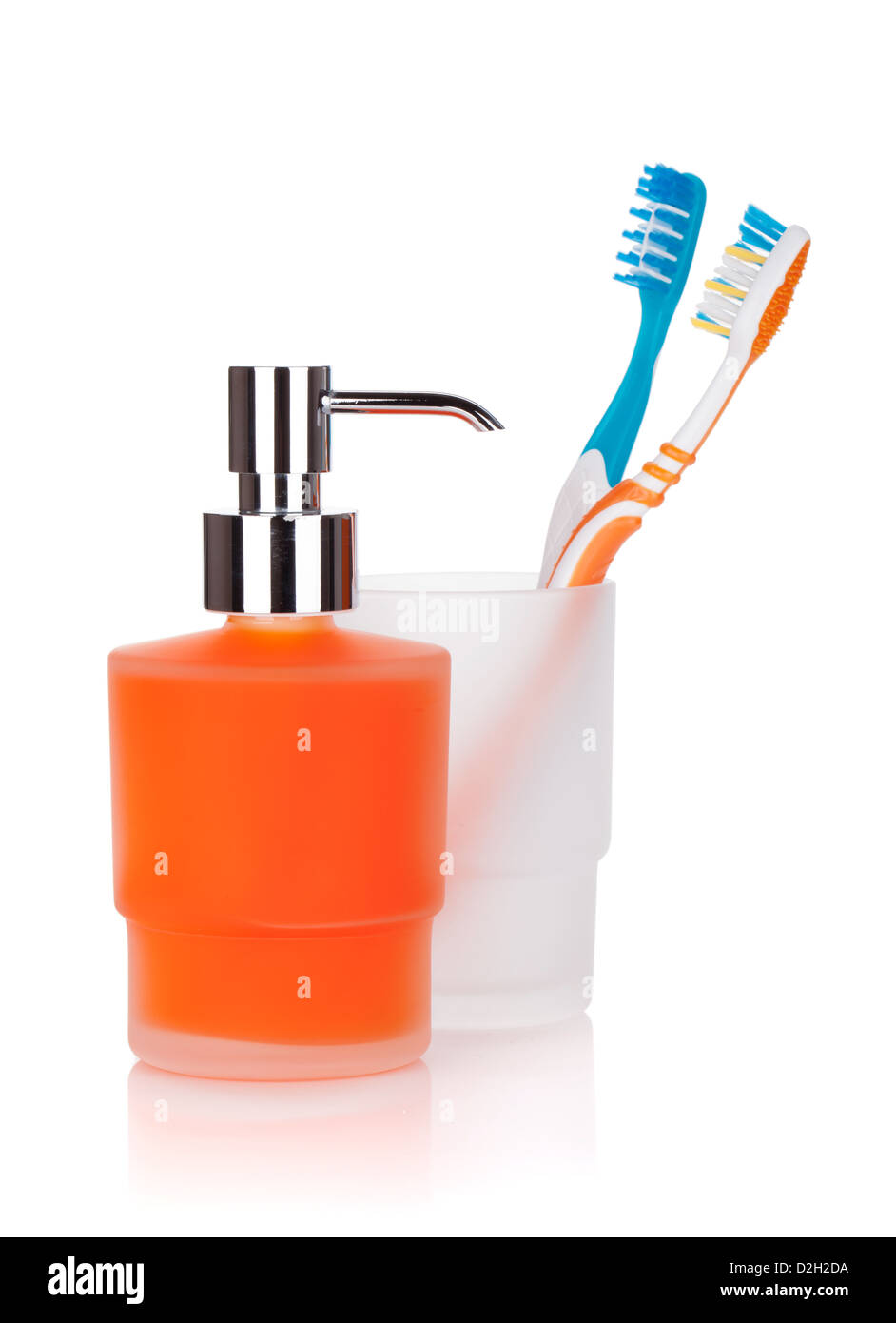 Two colorful toothbrushes and liquid soap. Isolated on white background ...