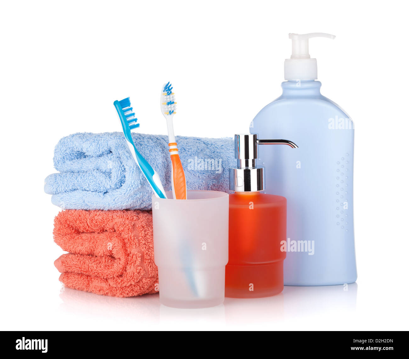 Toothbrushes, shampoo bottles and two towels. Isolated on white ...
