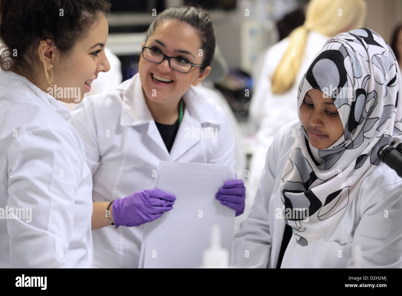 Female university students enjoying science research, university, UK ...