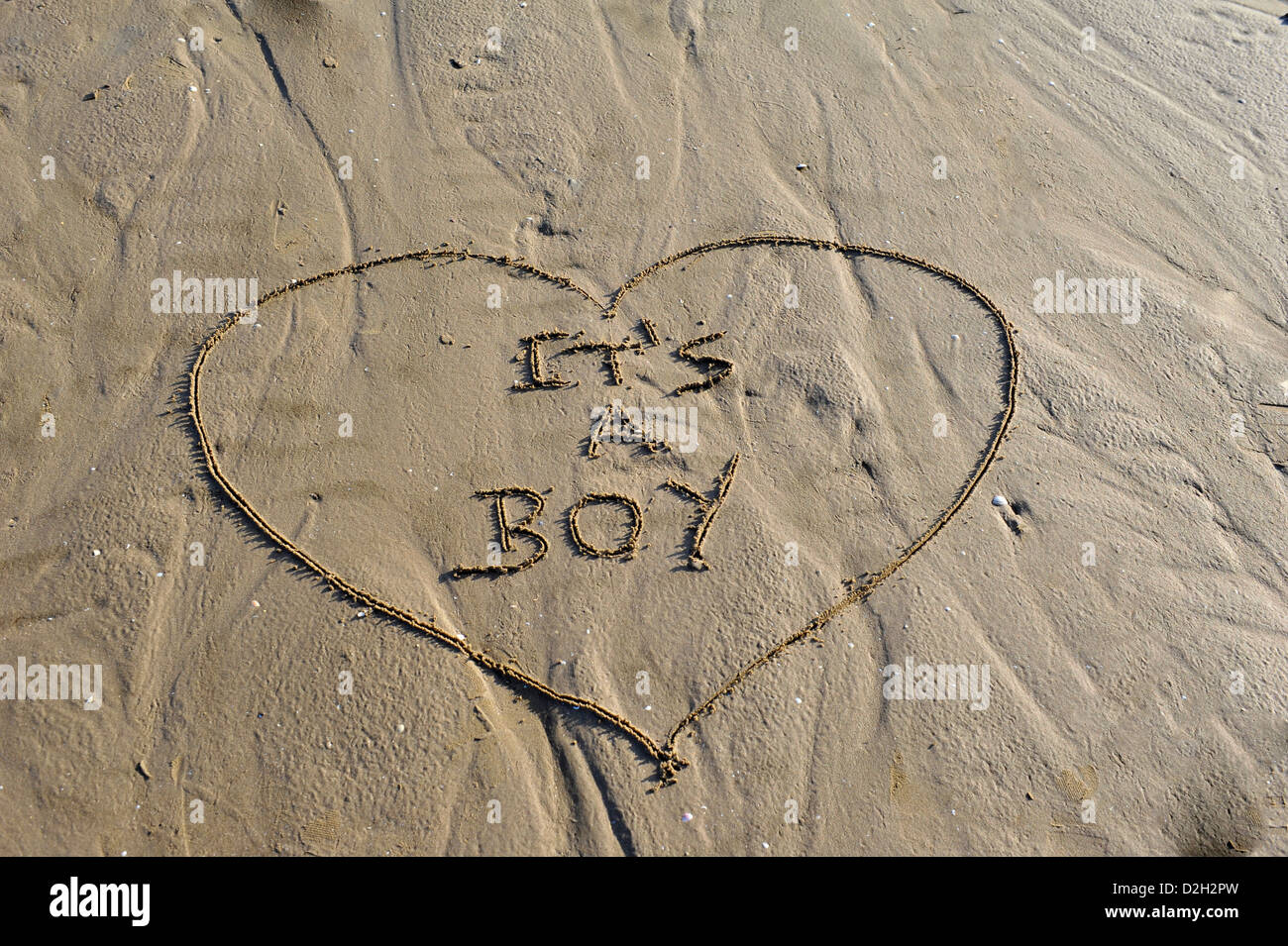 Word It's a boy written in sand Stock Photo - Alamy