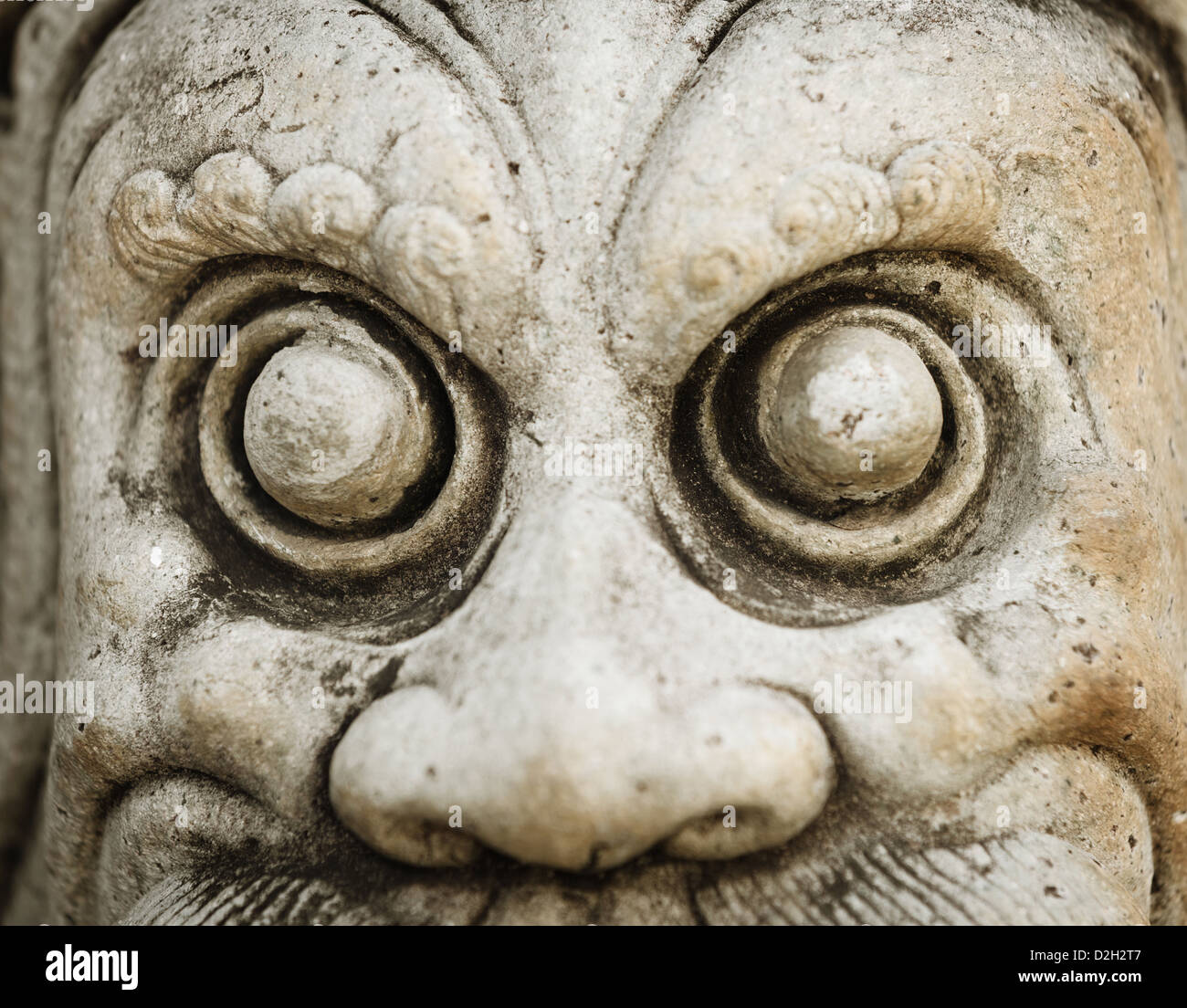 Close-up of stone old male statue with protruding eyes Stock Photo - Alamy