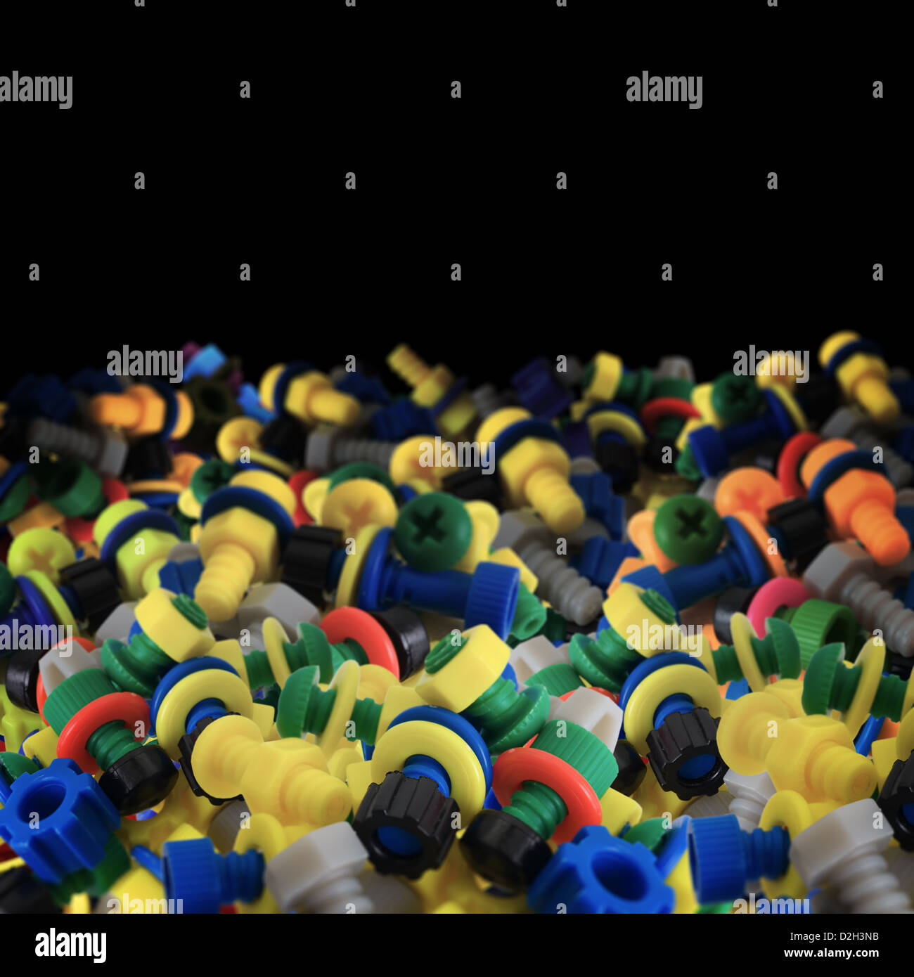 Toy plastic bolts and nuts close up Stock Photo - Alamy