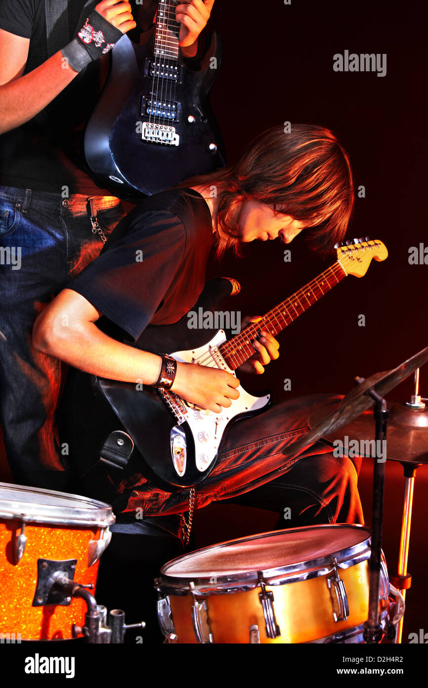 Man playing guitar in night club Stock Photo - Alamy