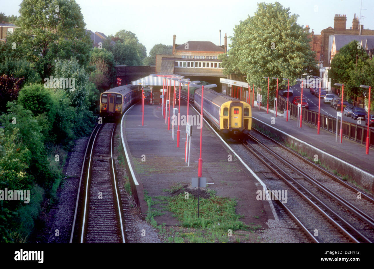 Two trains passing through St. Margaret's train station, Twickenham ...