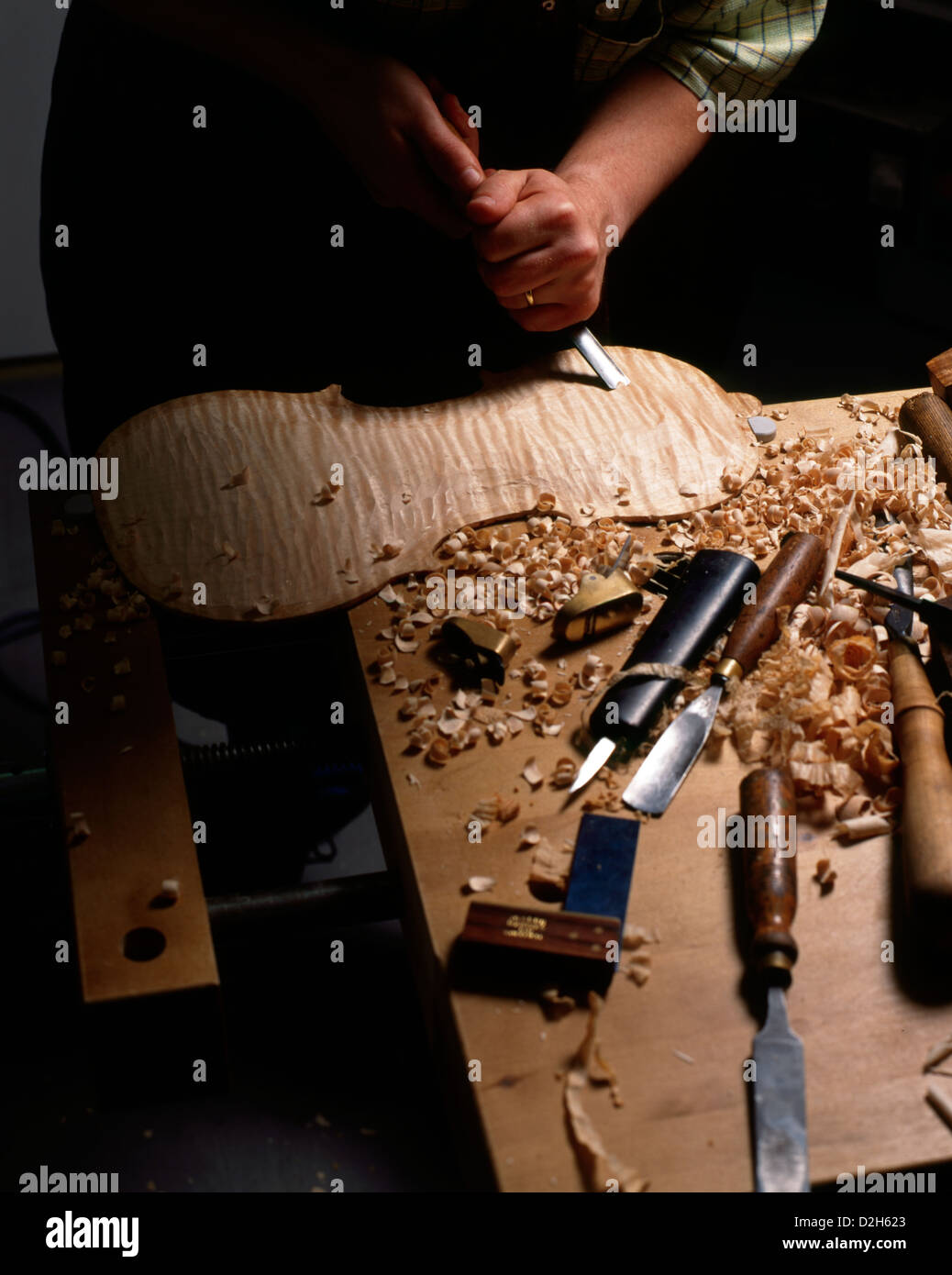 Violin maker luthier carving violin Stock Photo - Alamy