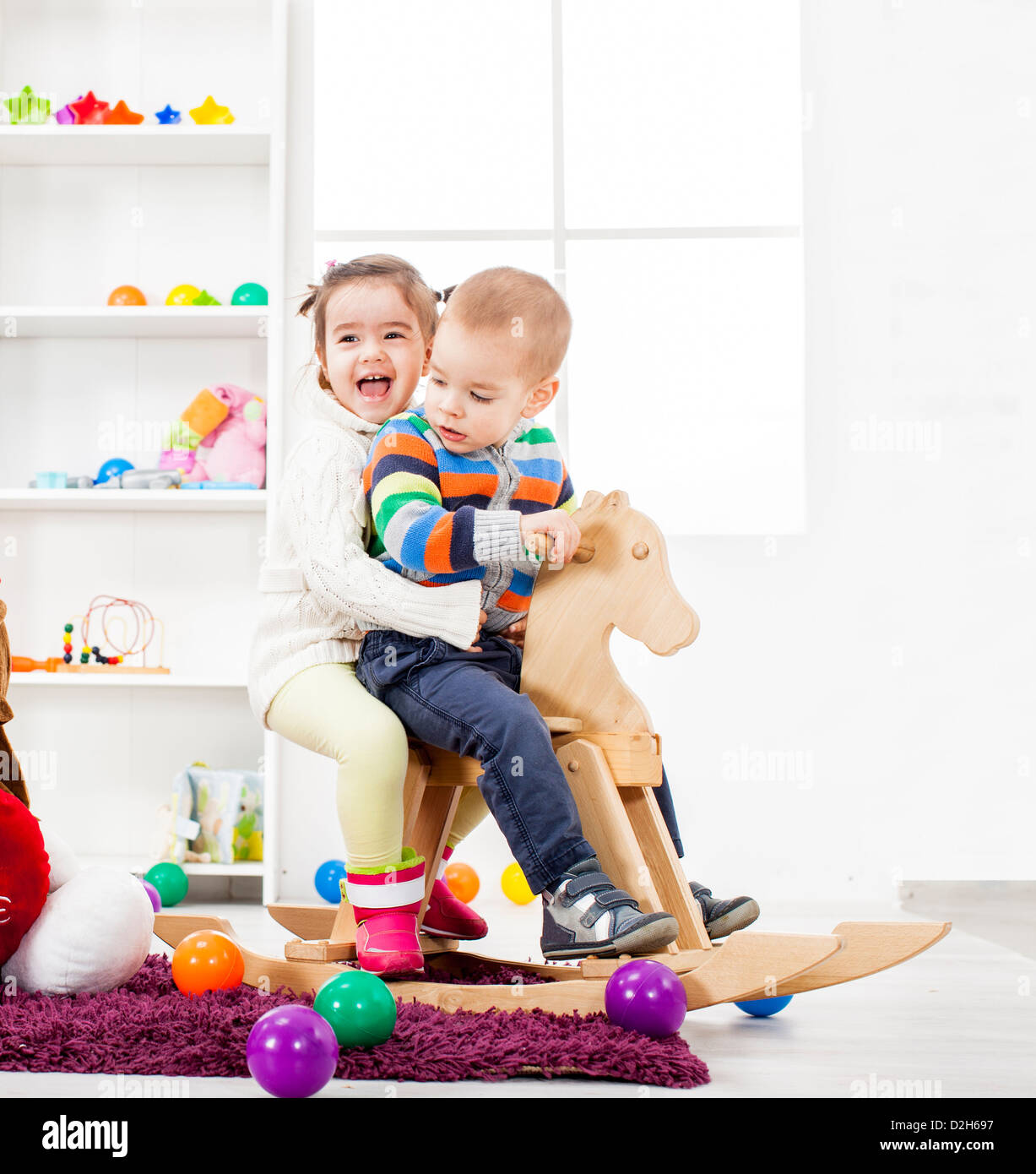 Kids playing in the room Stock Photo - Alamy