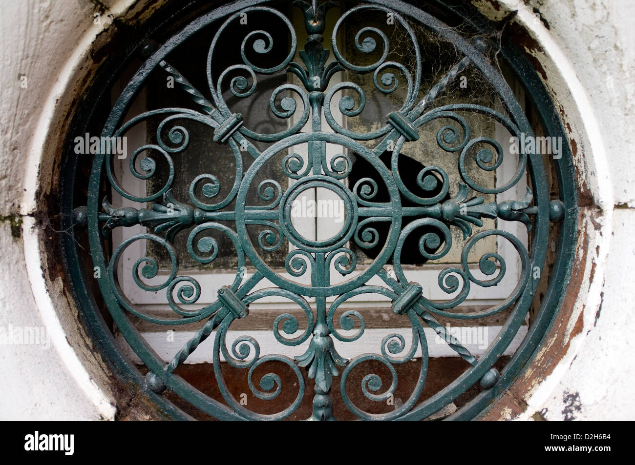 Round window and iron work Stock Photo - Alamy