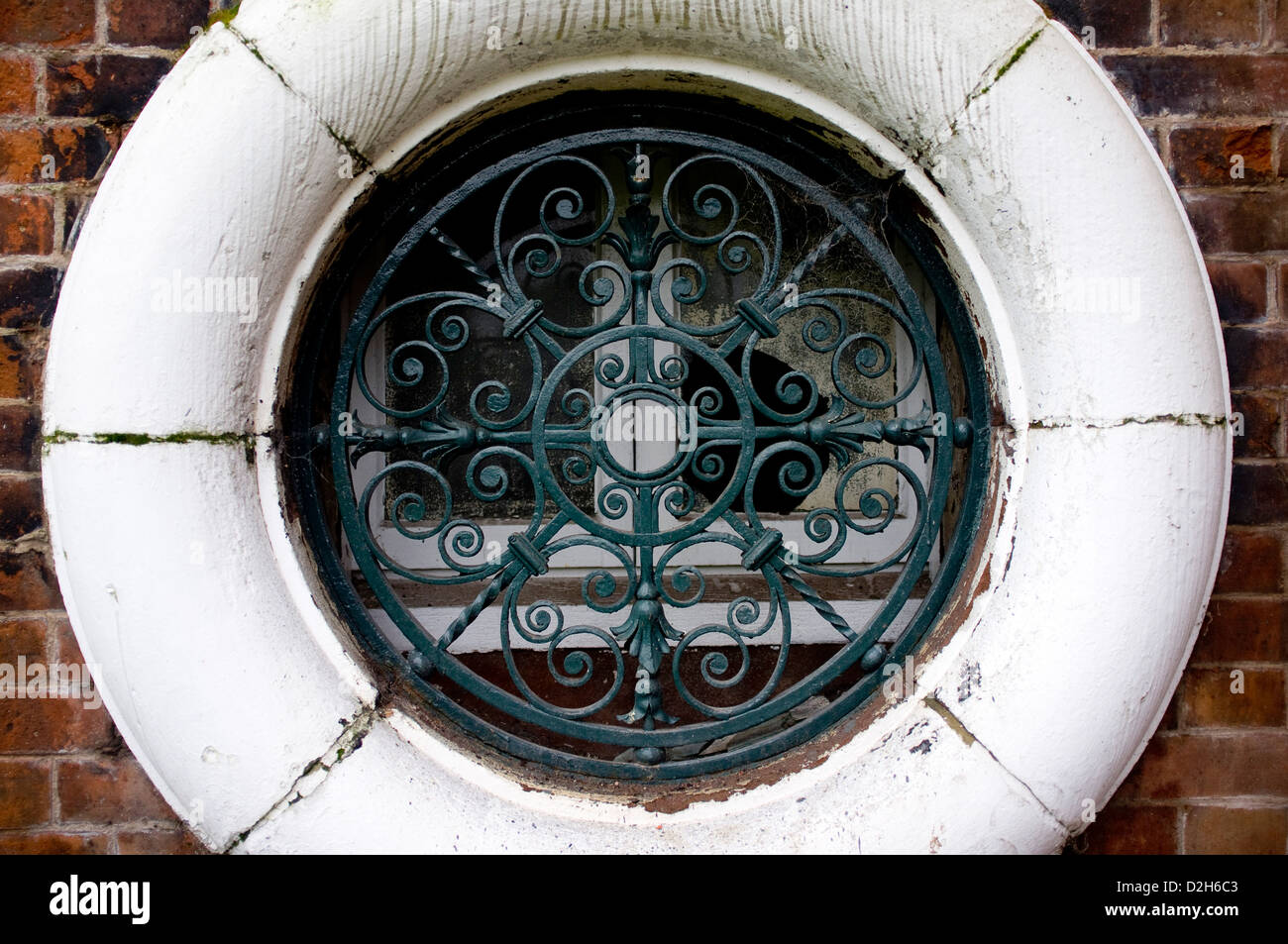 Round window and iron work Stock Photo - Alamy