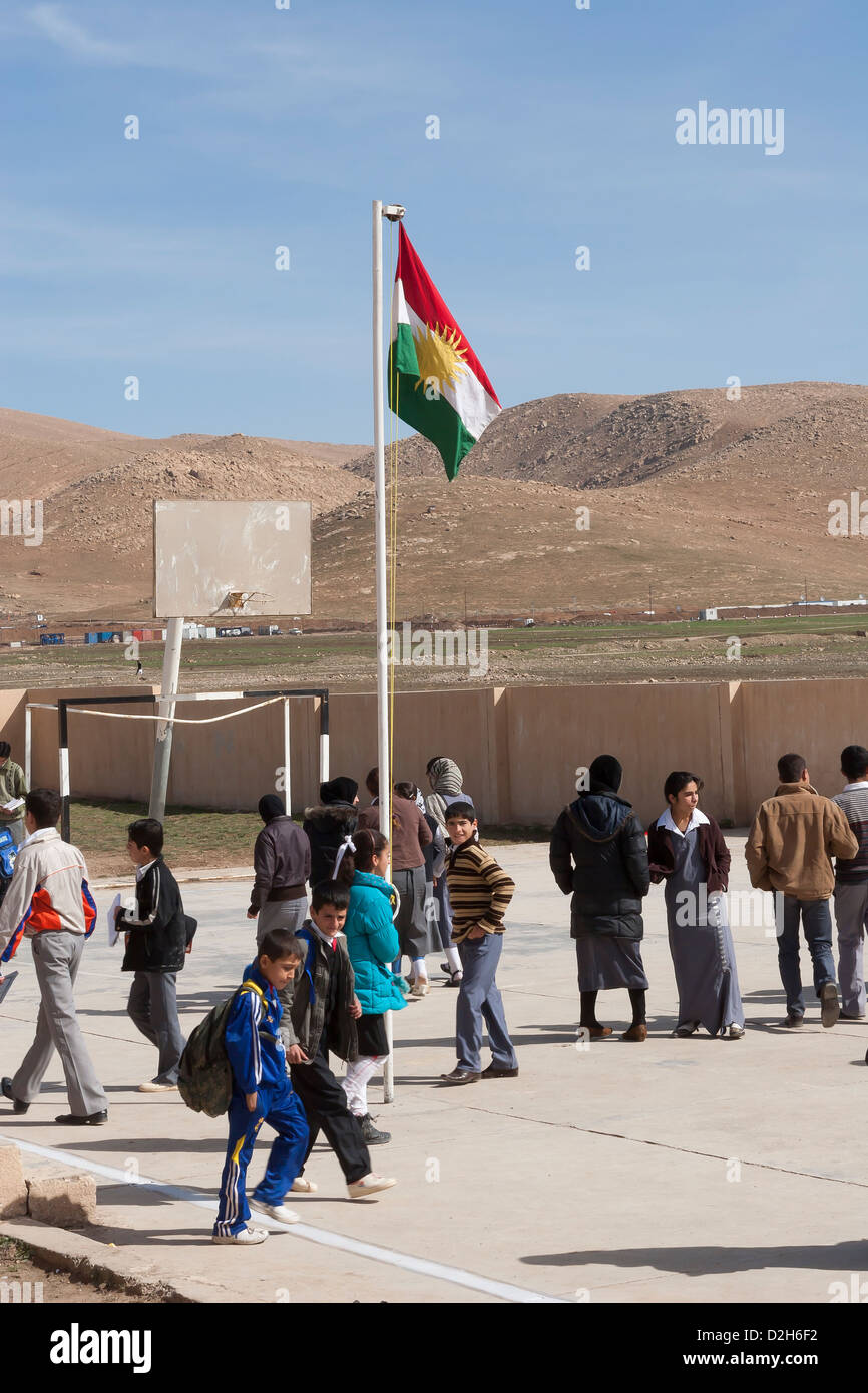 Primary and senior students in playground outside Iraqi Kurdish school ...