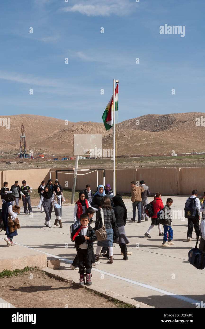Primary and senior students in playground outside Iraqi Kurdish school ...