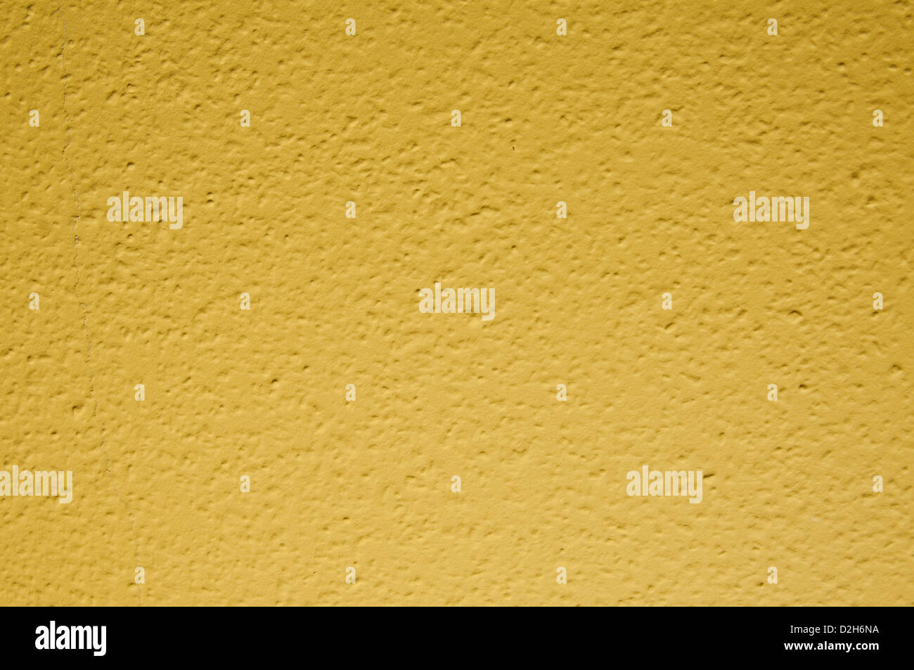 pale yellow structural painted wallpaper on the wall Stock Photo - Alamy