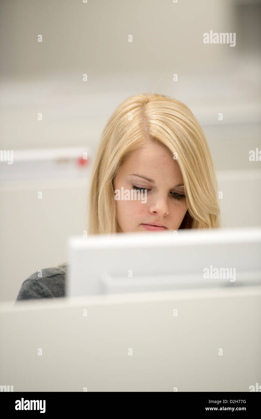 young woman works with personal computer Stock Photo - Alamy