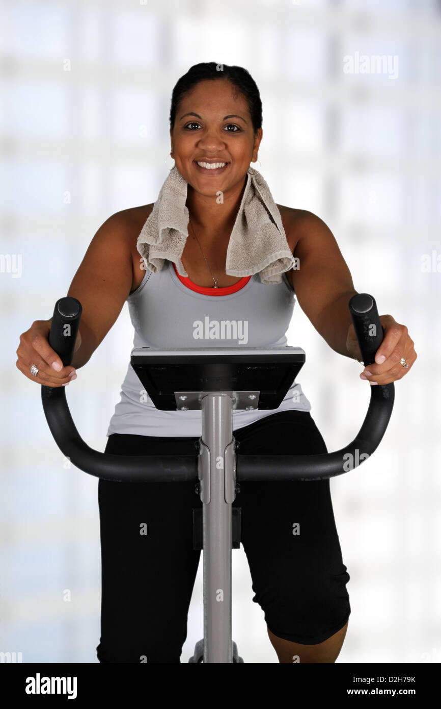 Woman working out while at a gym Stock Photo - Alamy