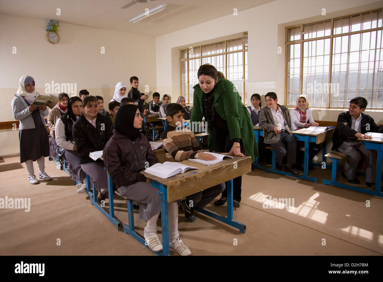 Inside secondary school classroom with male and female Muslim teenage ...