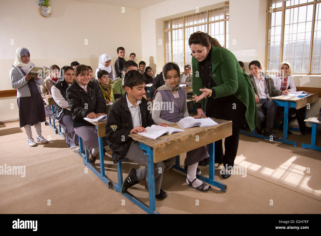 Inside secondary school classroom with male and female Muslim teenage ...