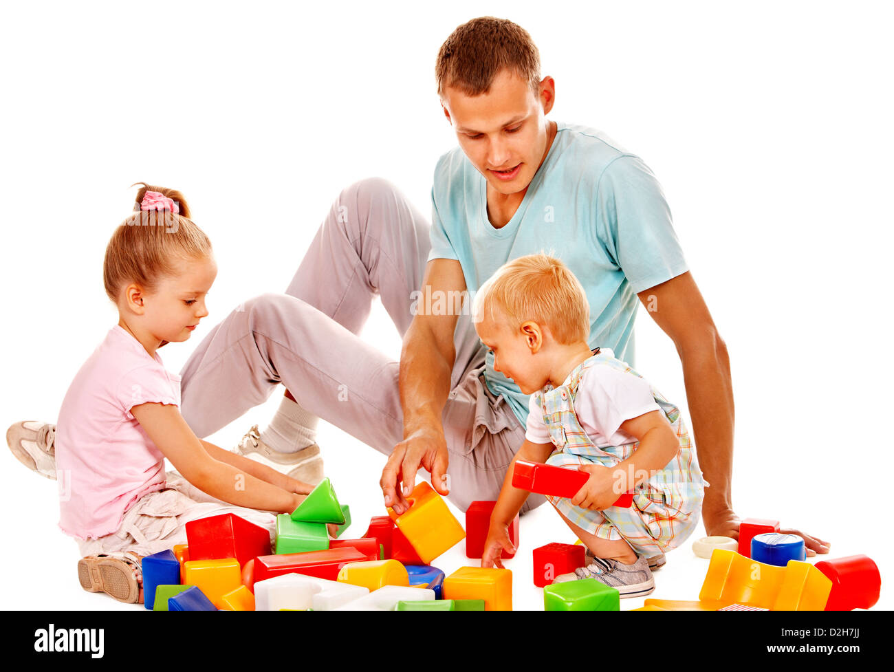 Happy family with child playing building blocks Stock Photo - Alamy
