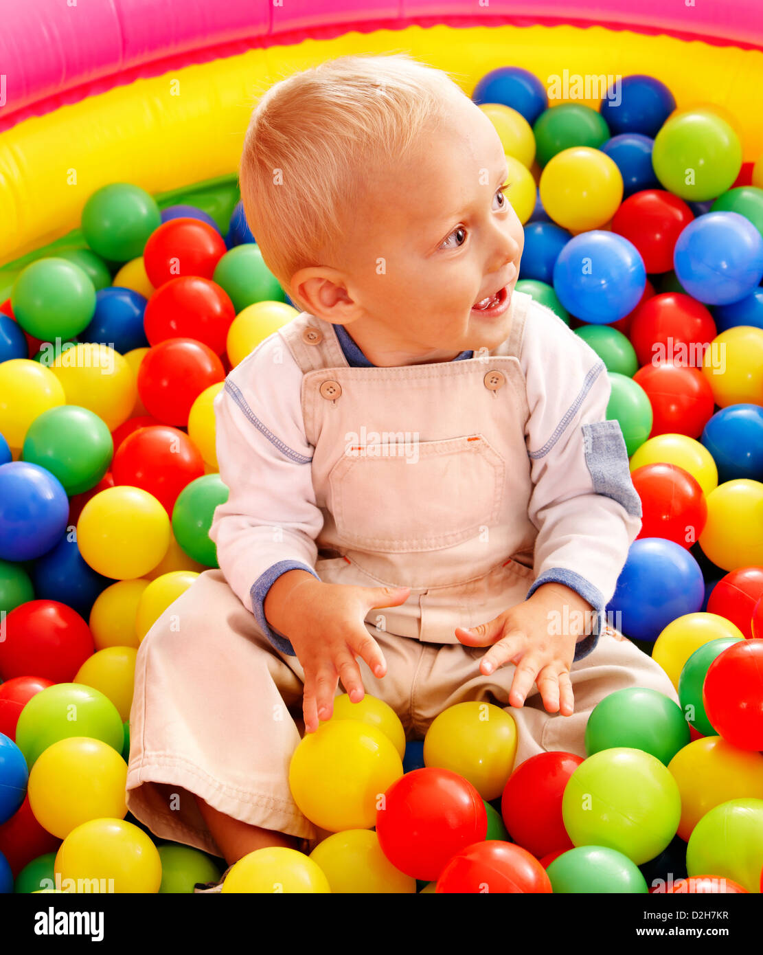 Little boy in colored ball Stock Photo - Alamy
