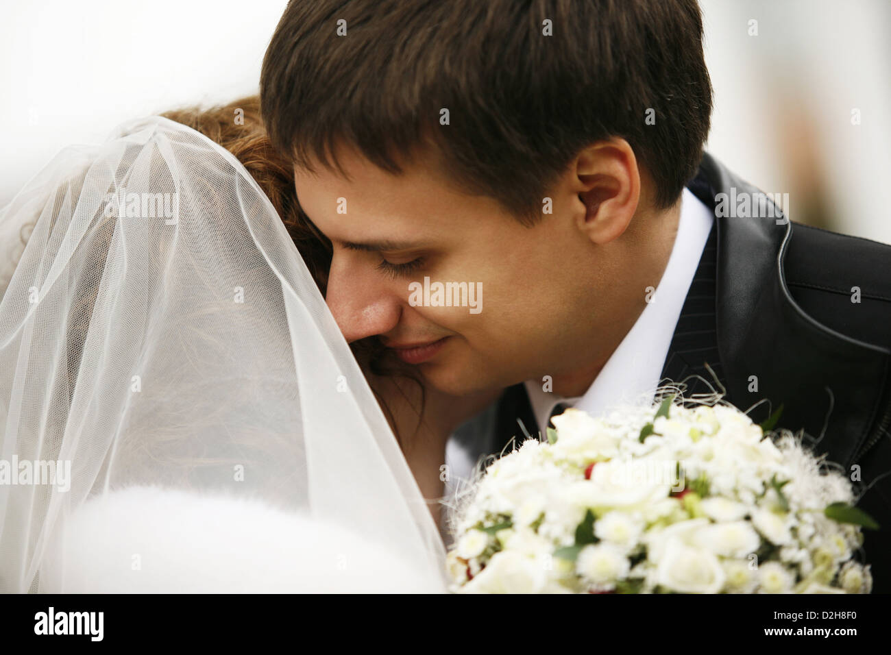 Married couple groom embraces hi-res stock photography and images - Alamy