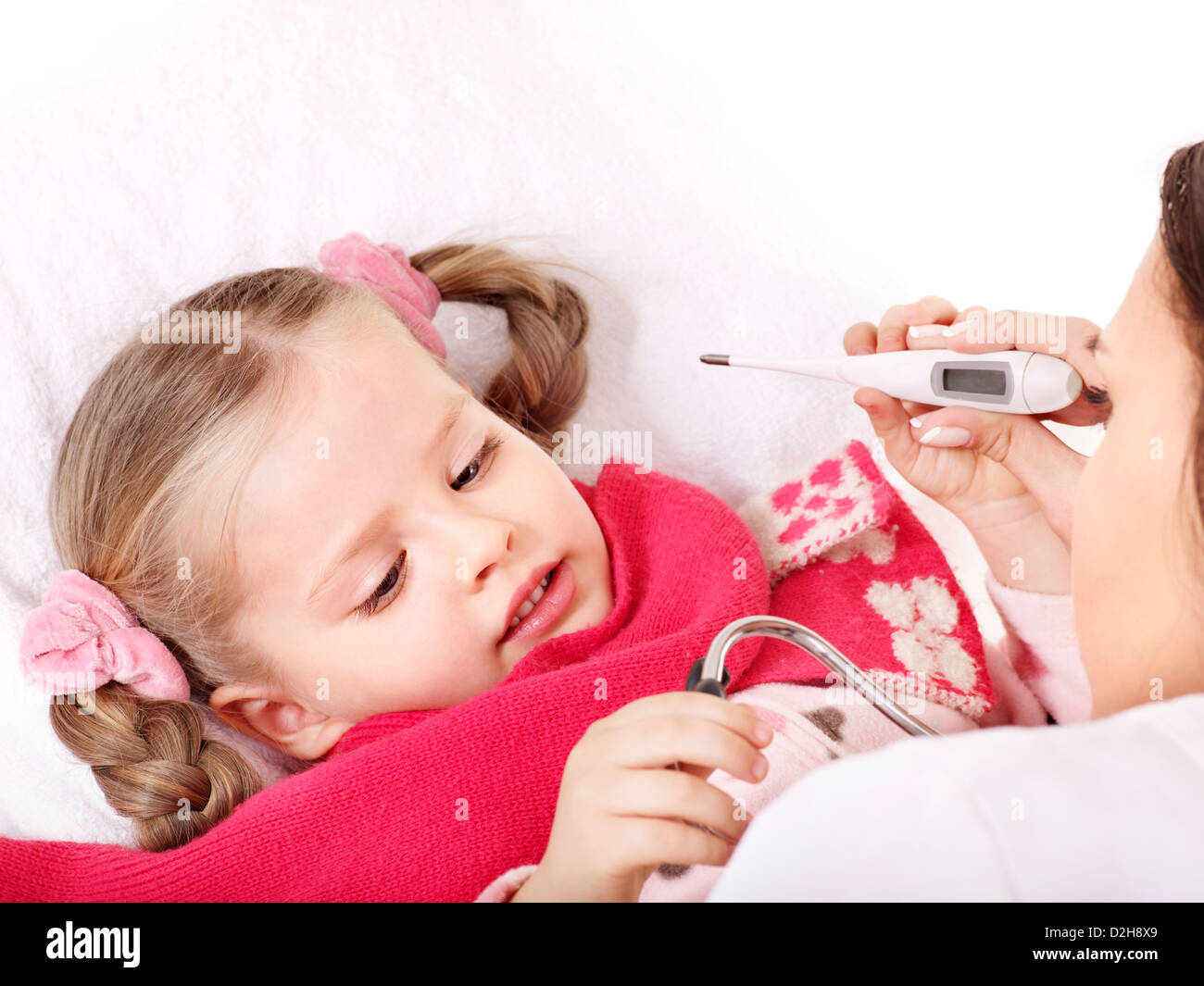 Sick child take medicine with doctor Stock Photo - Alamy