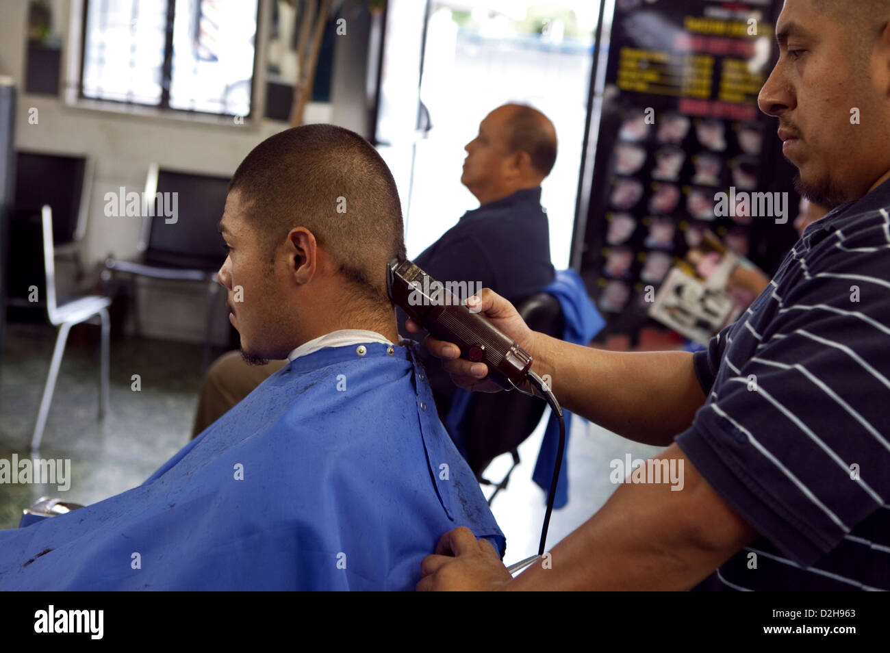 young hispanic locals getting haircuts at Oaxaca barber shop ON La ...