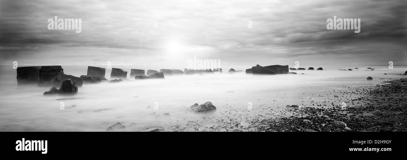Machine gun turrets from World War II on a beach on the east coast ...