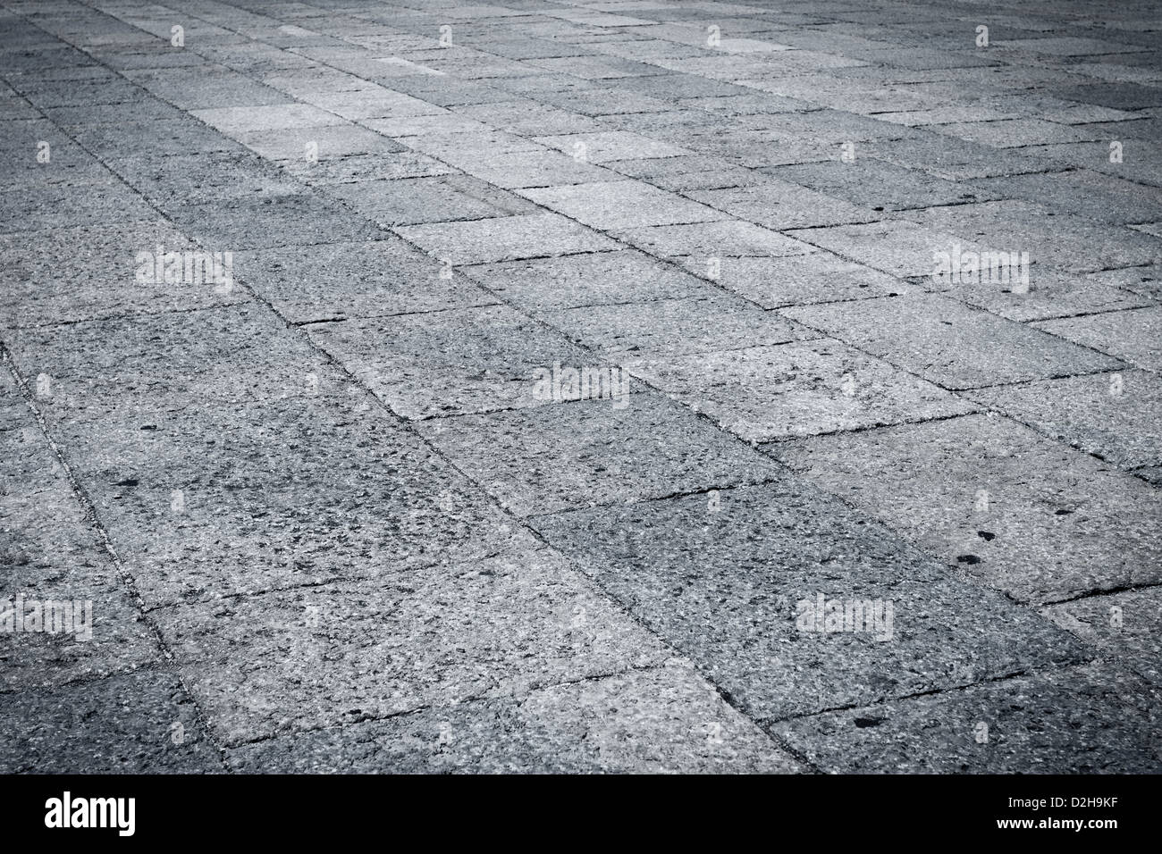 The fragment of a town square pavement. Side view Stock Photo - Alamy