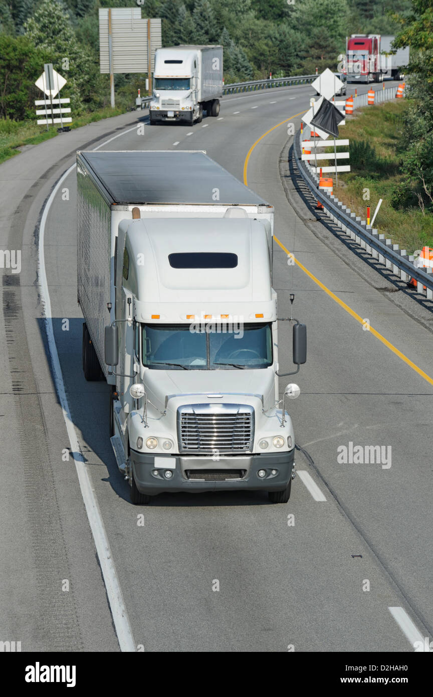 Truck traffic moving on an American interstate highway, commercial ...