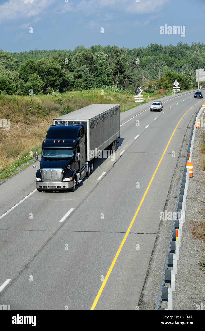 Truck traffic moving on an American interstate highway, commercial ...