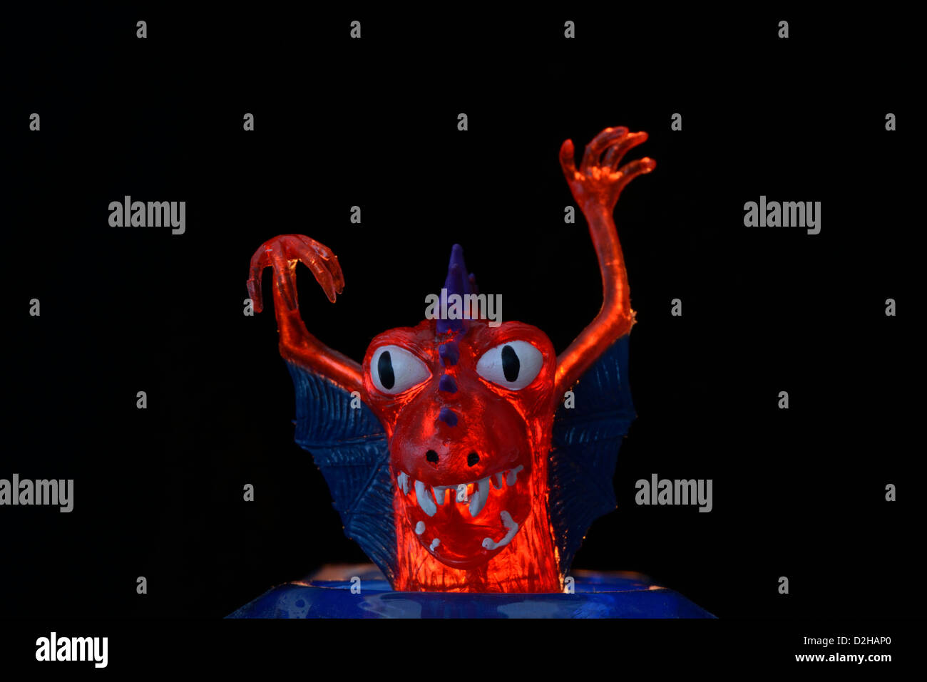 Demon finger puppet backlit by candlelight Stock Photo - Alamy