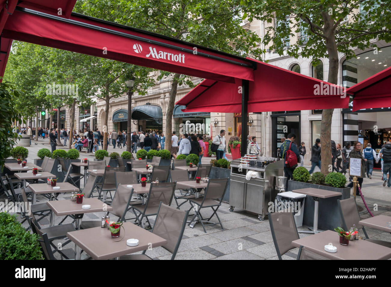 Outdoor cafes and shops along Avenue des Champs-Elysees in Paris,France ...