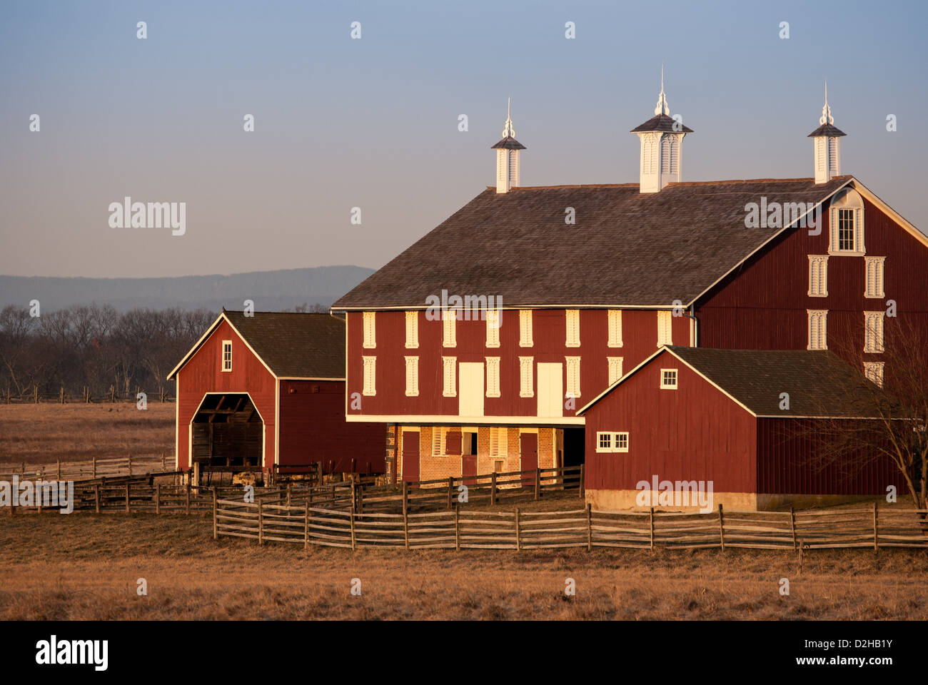 Large red barn in a rural setting during sunrise Stock Photo - Alamy