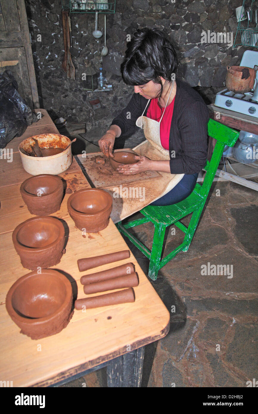 female potter labouring at her workshop Stock Photo - Alamy