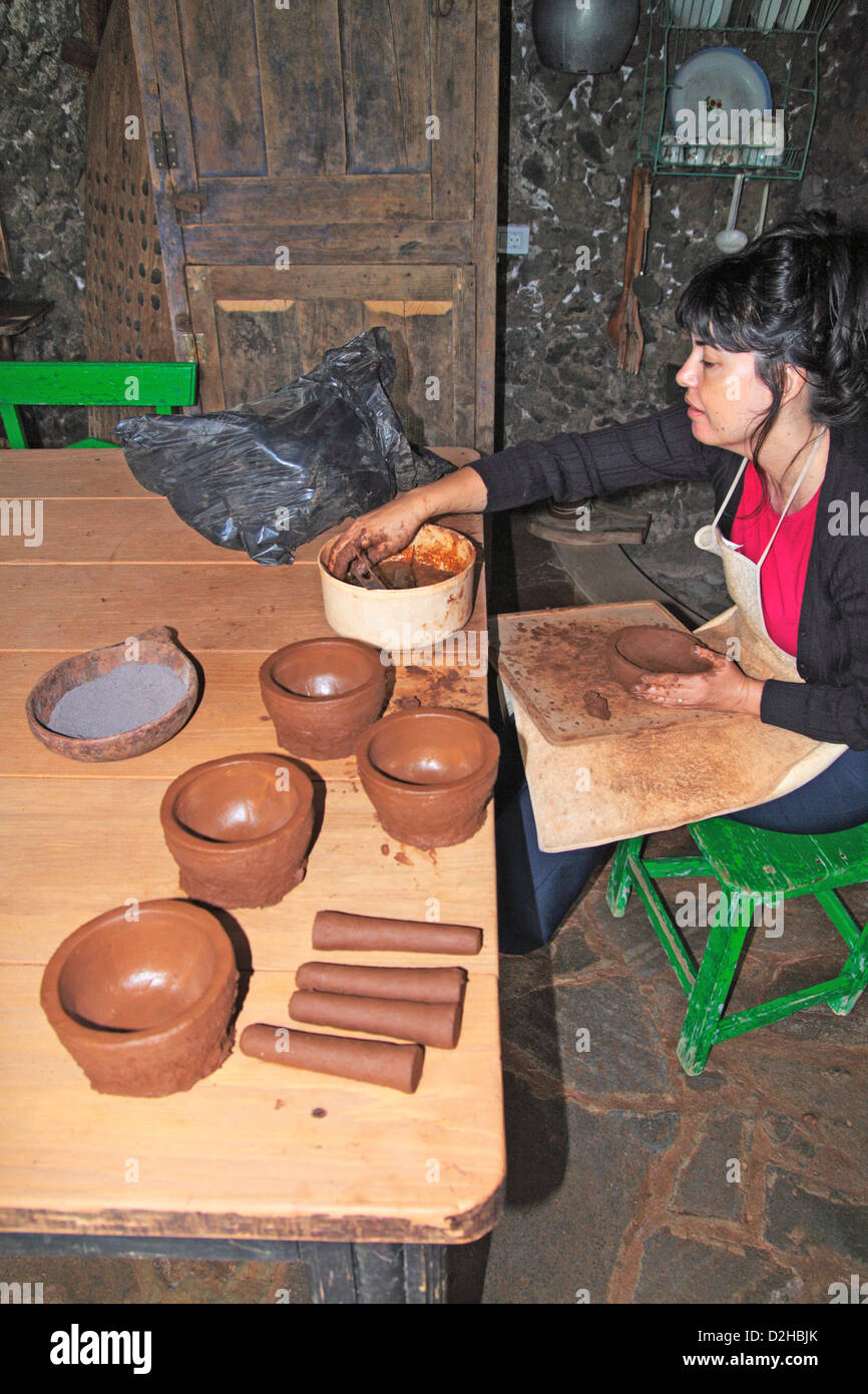 female potter labouring at her workshop Stock Photo - Alamy