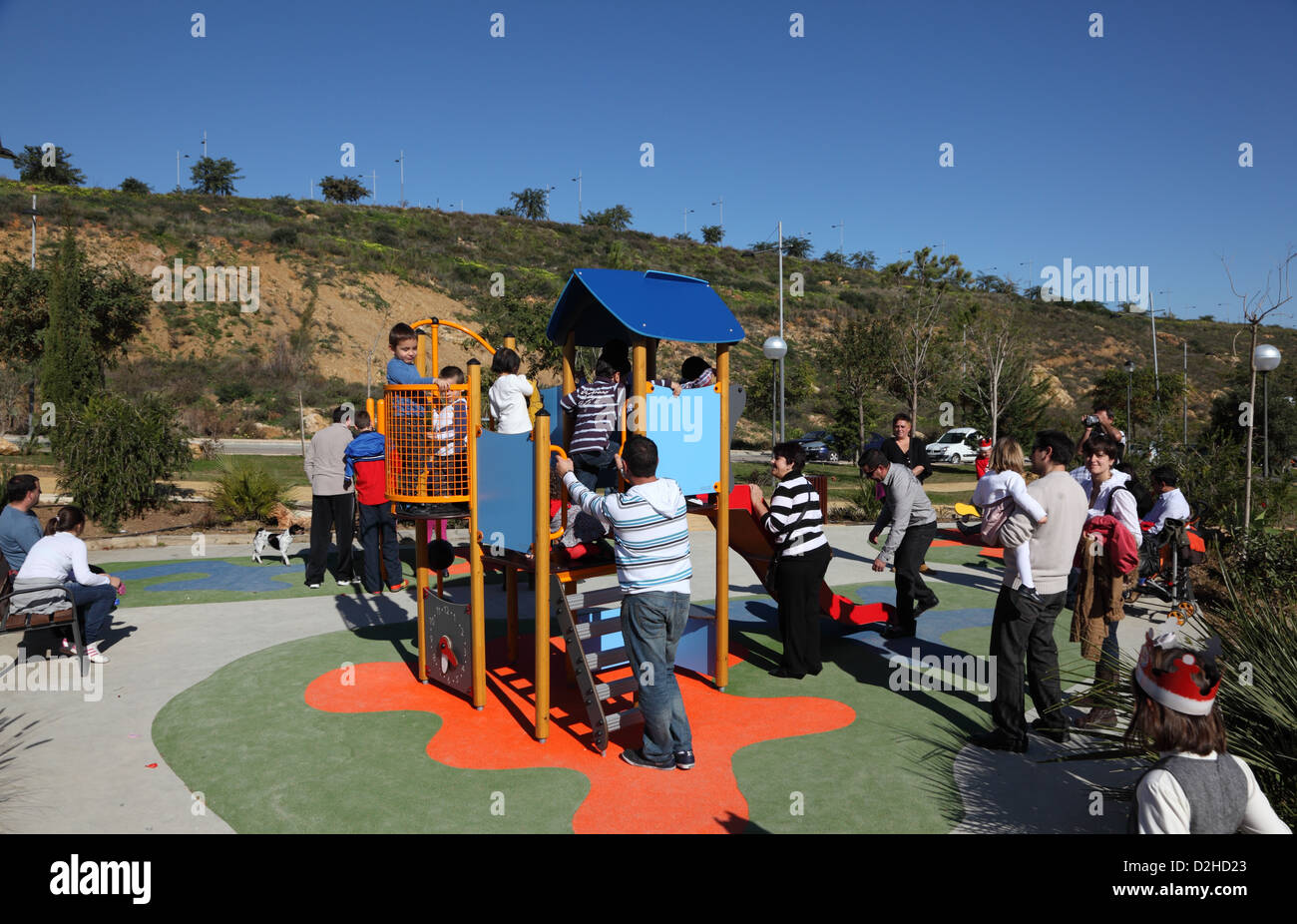 Parents with their children on a crowded playground. Estepona ...