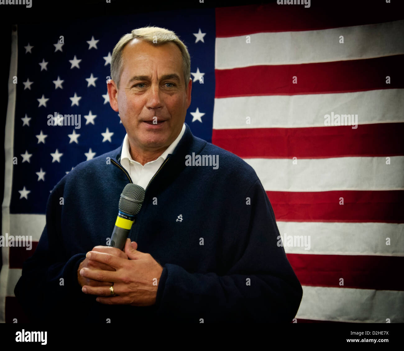 Speaker Boehner standing in front of American flag on stage with smile ...