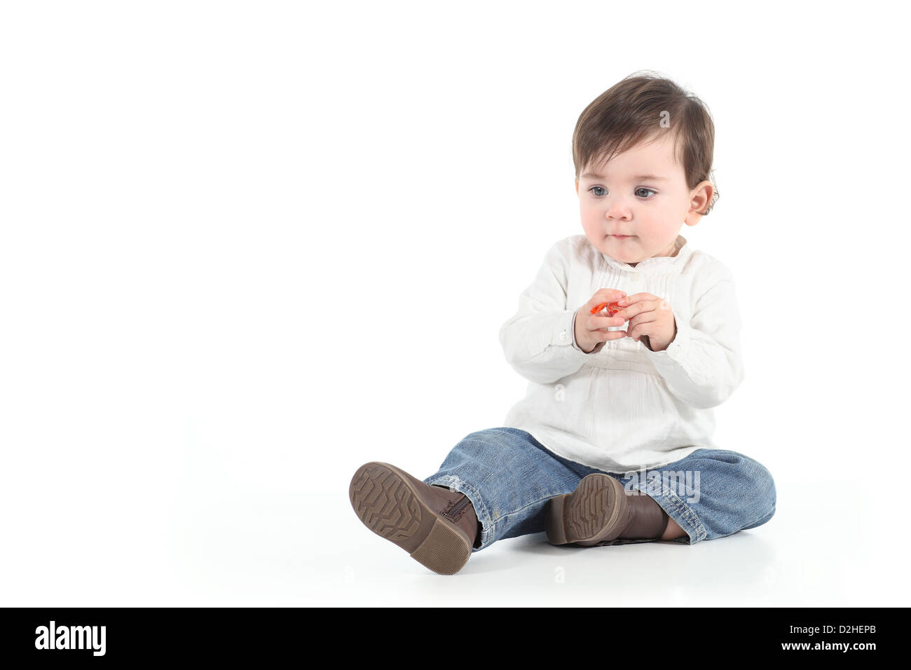 Baby with a candy in her hands on a white isolated background Stock ...