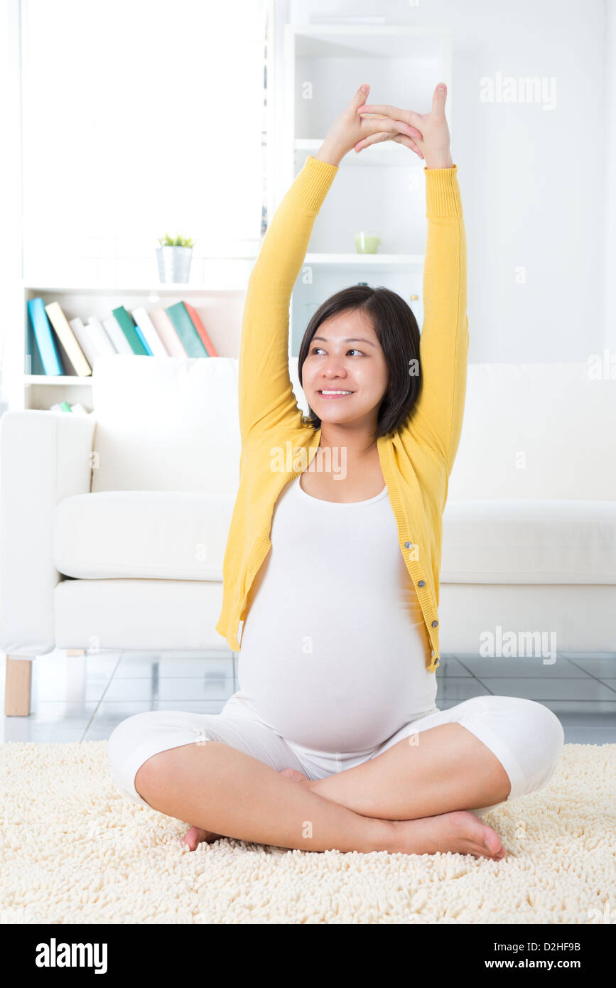 Maternity Health Concept Asian Pregnant Woman Stretching At Home Stock