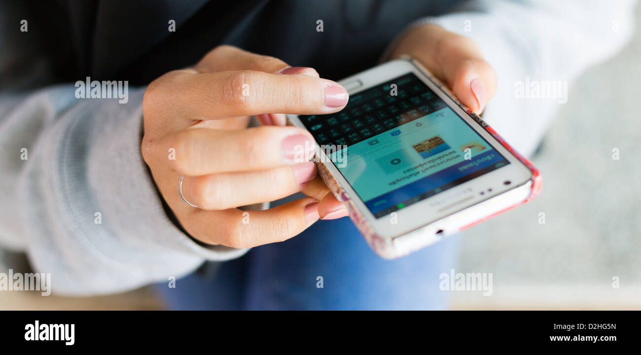 Girl finger touching screen on mobile smart phone Stock Photo - Alamy