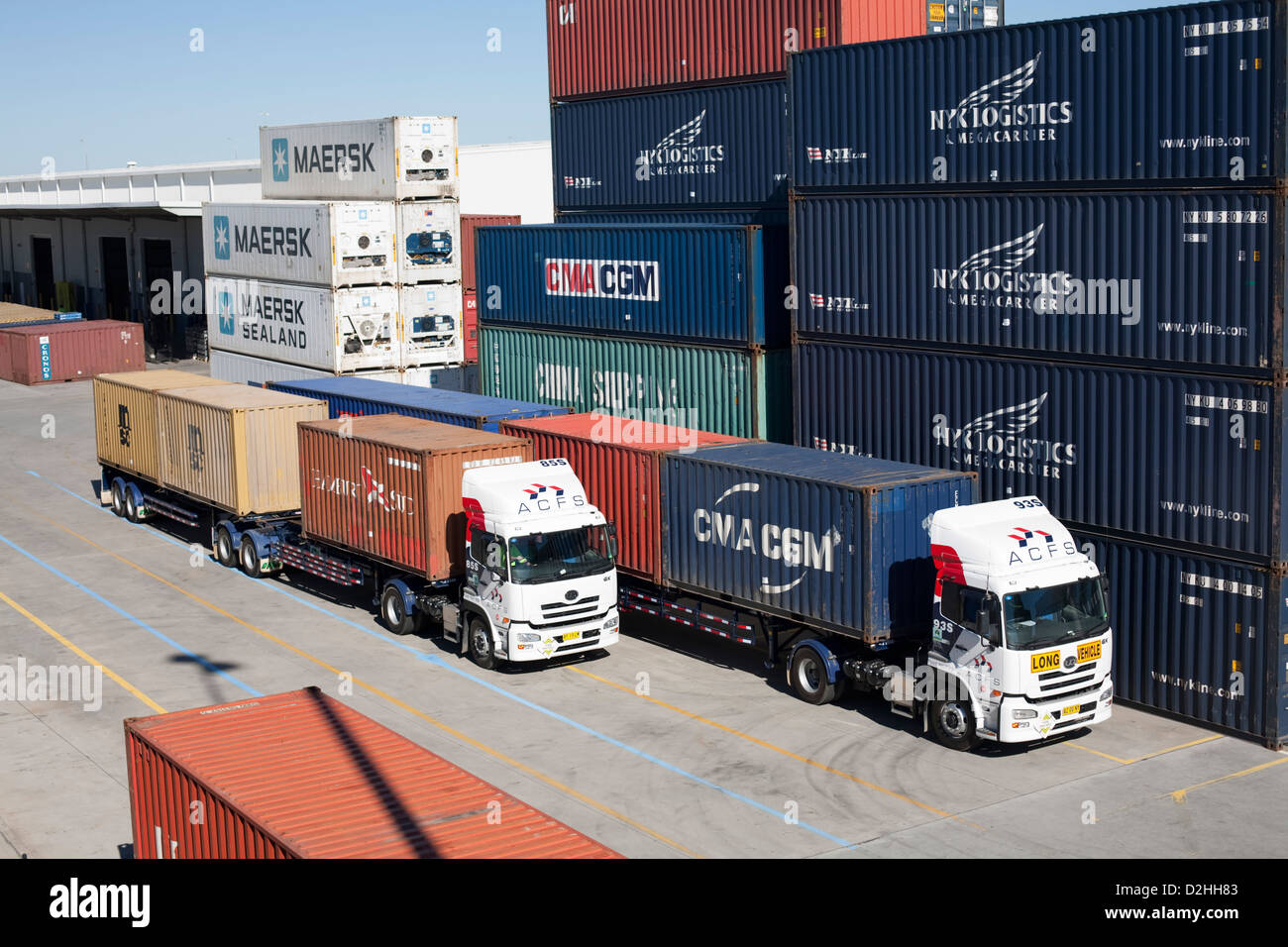 Trucks loading shipping containers at the Brotherson Dock at Port ... Trucks loading shipping containers at the Brotherson Dock at Port ...