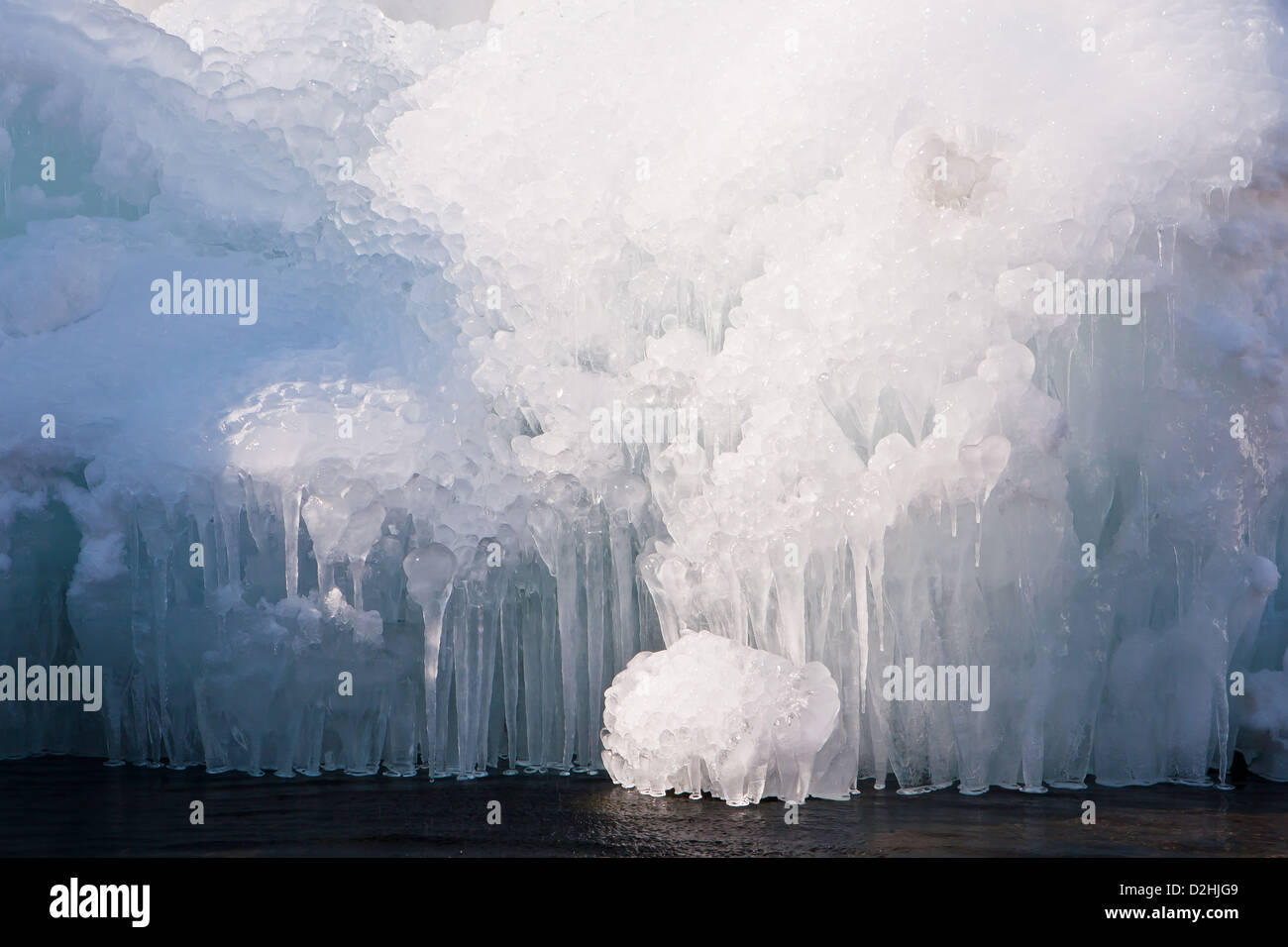 Iced over coast of a pond with a thermal spring Stock Photo - Alamy