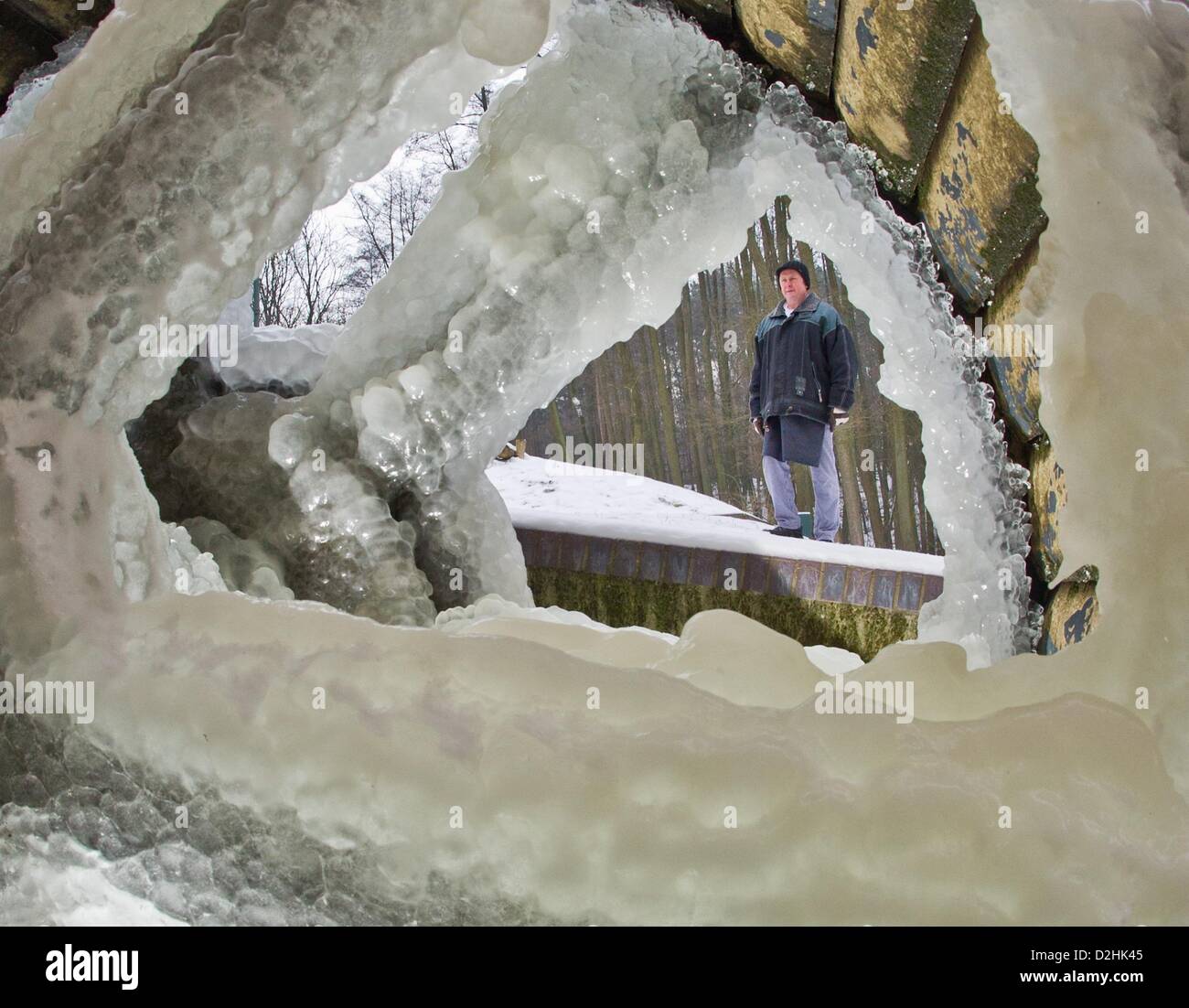 A mill wheel is coated with a thick layer of ice at minus 10 degrees ...