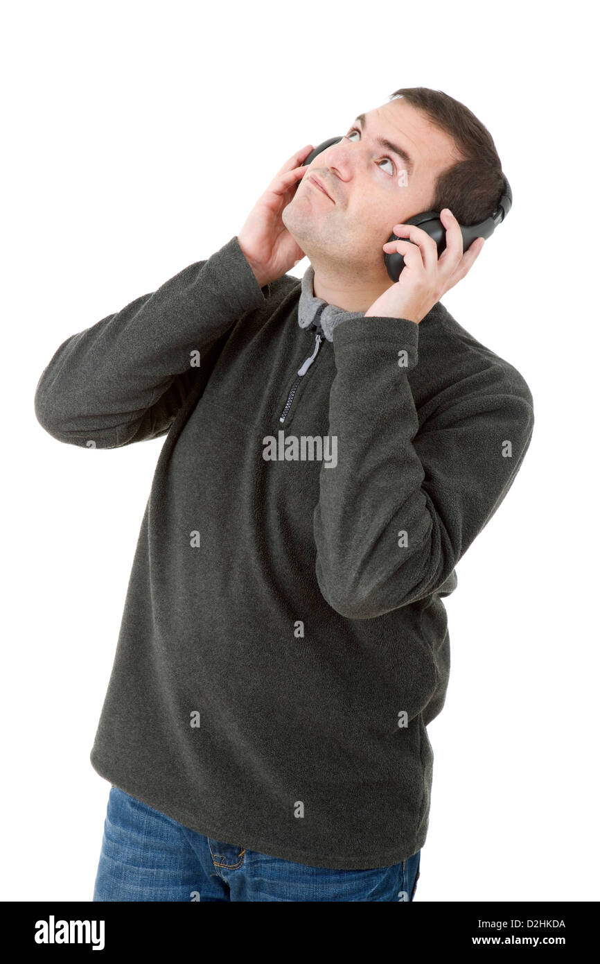 young casual man listening to music, isolated Stock Photo - Alamy