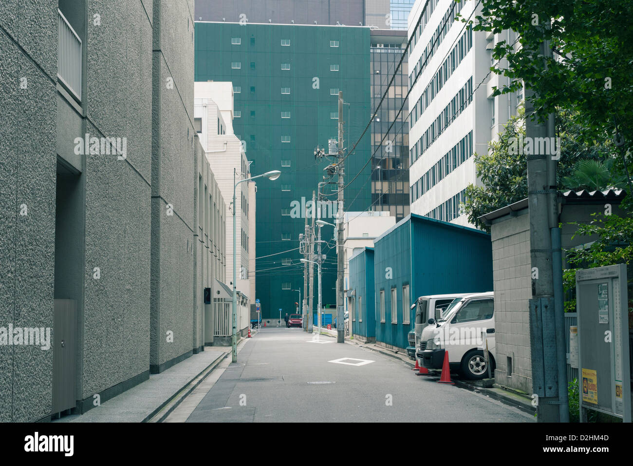 straight city driveway among huge buildings in Tokyo Stock Photo - Alamy