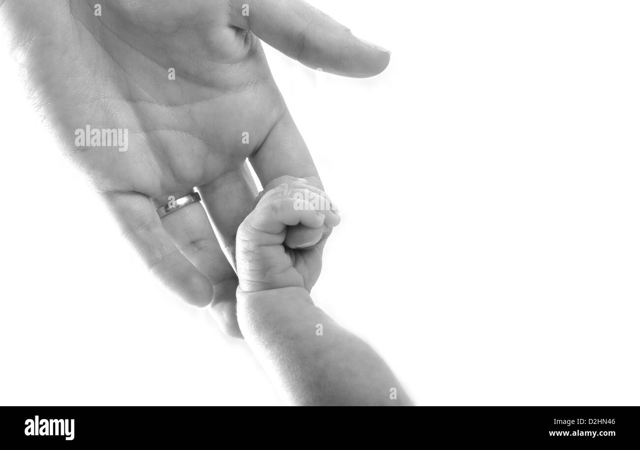 Mum giving her new baby a hand in life Stock Photo - Alamy