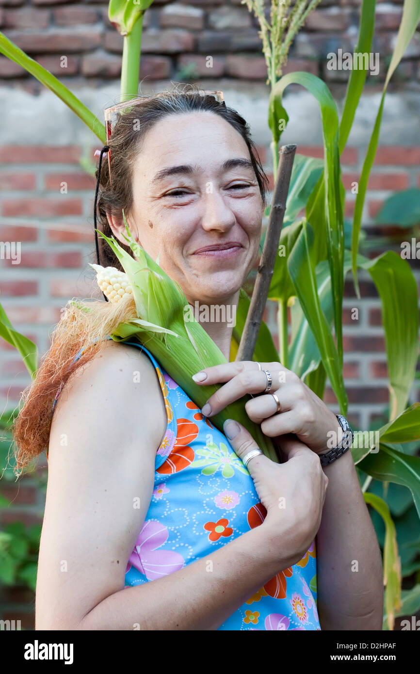 woman in the garden with corn Stock Photo - Alamy